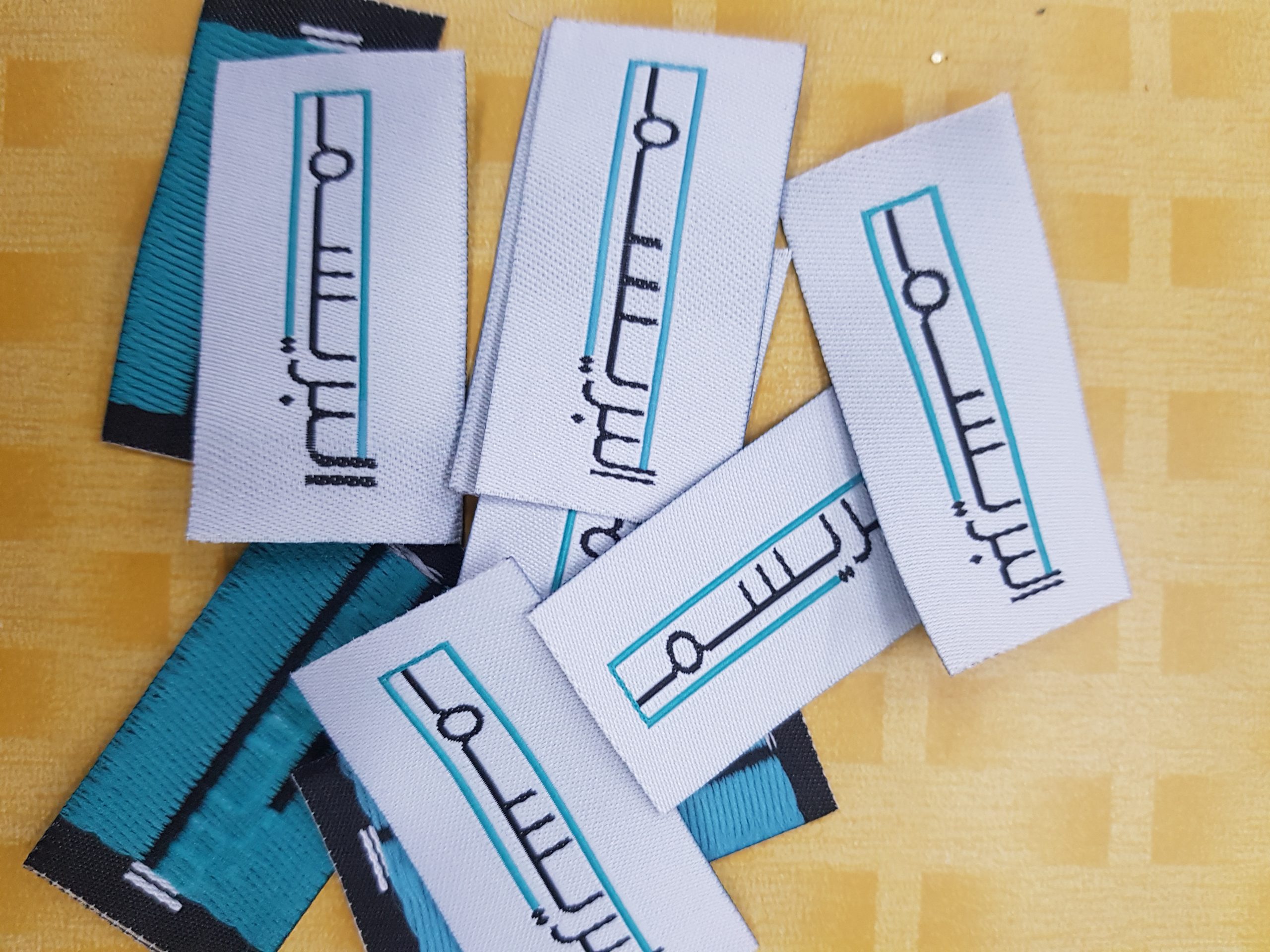 Woven Clothing Labels Manufacturing 2024 | Lamora Tailoring Factory